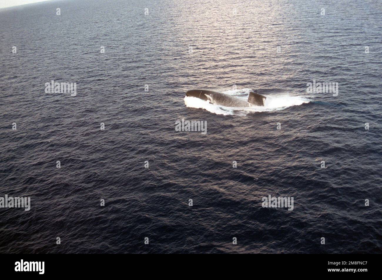 The bow and sail of the nuclear-powered attack submarine USS ALEXANDRIA ...