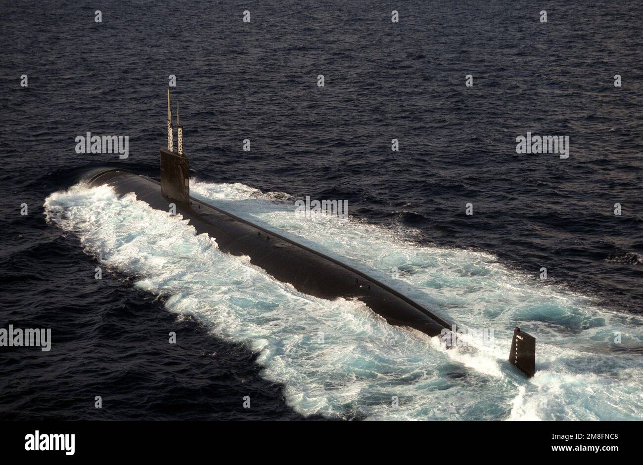 A port quarter view of the nuclear-powered attack submarine USS ...