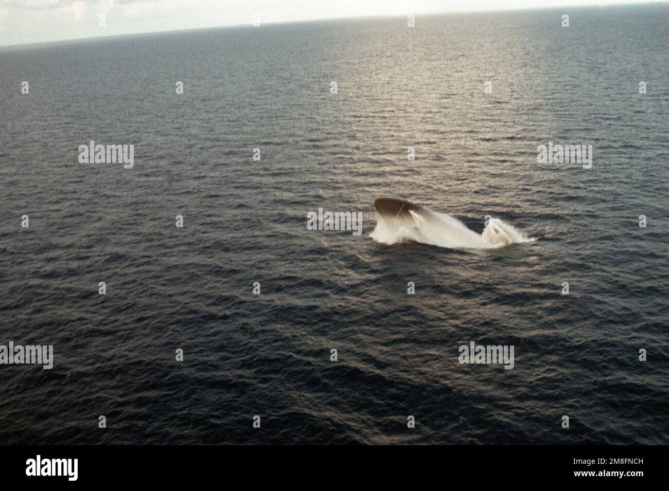 The nuclear-powered attack submarine USS ALEXANDRIA (SSN-757) surfaces ...