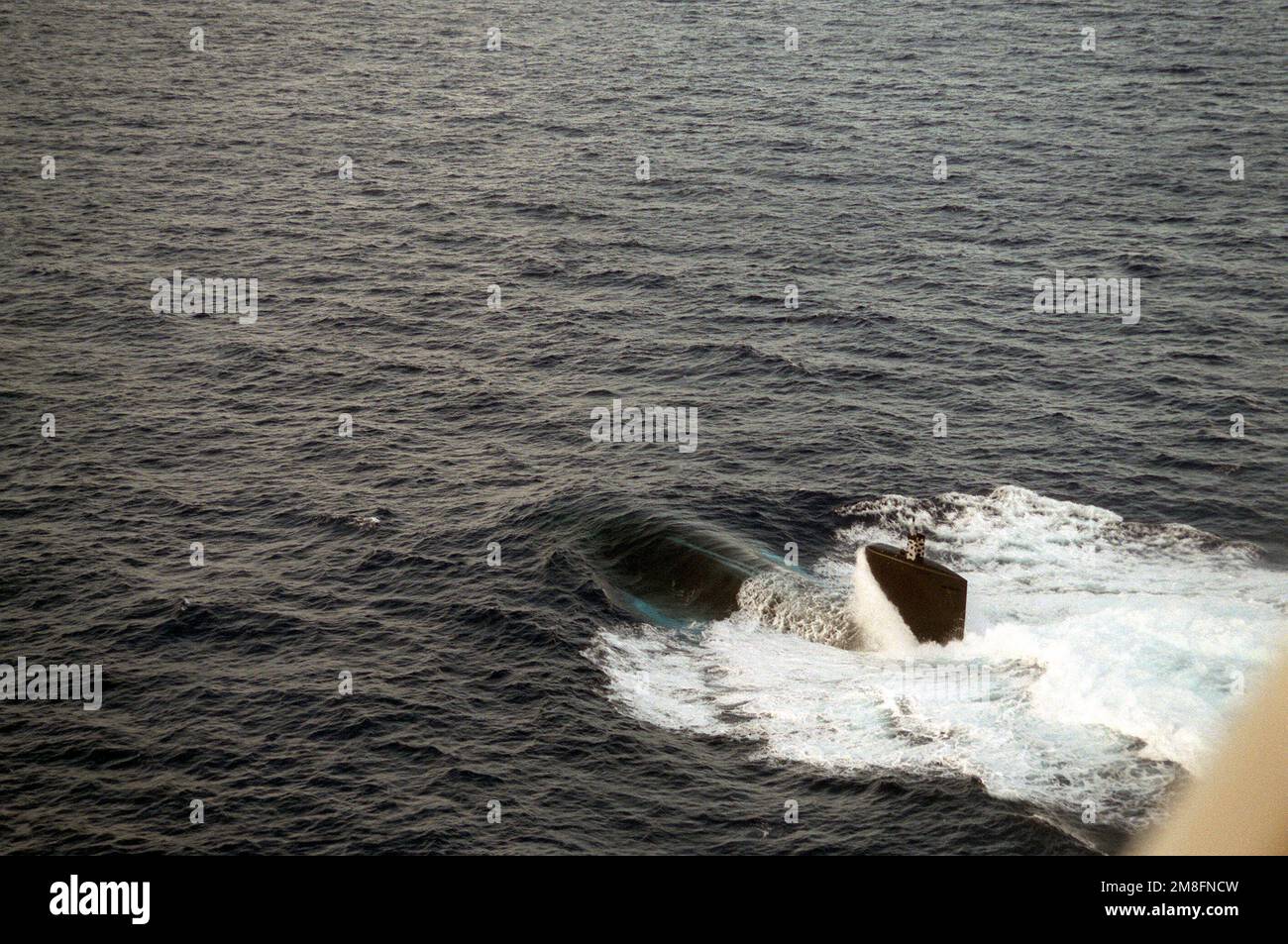 The nuclear-powered attack submarine USS ALEXANDRIA (SSN-757) surfaces ...