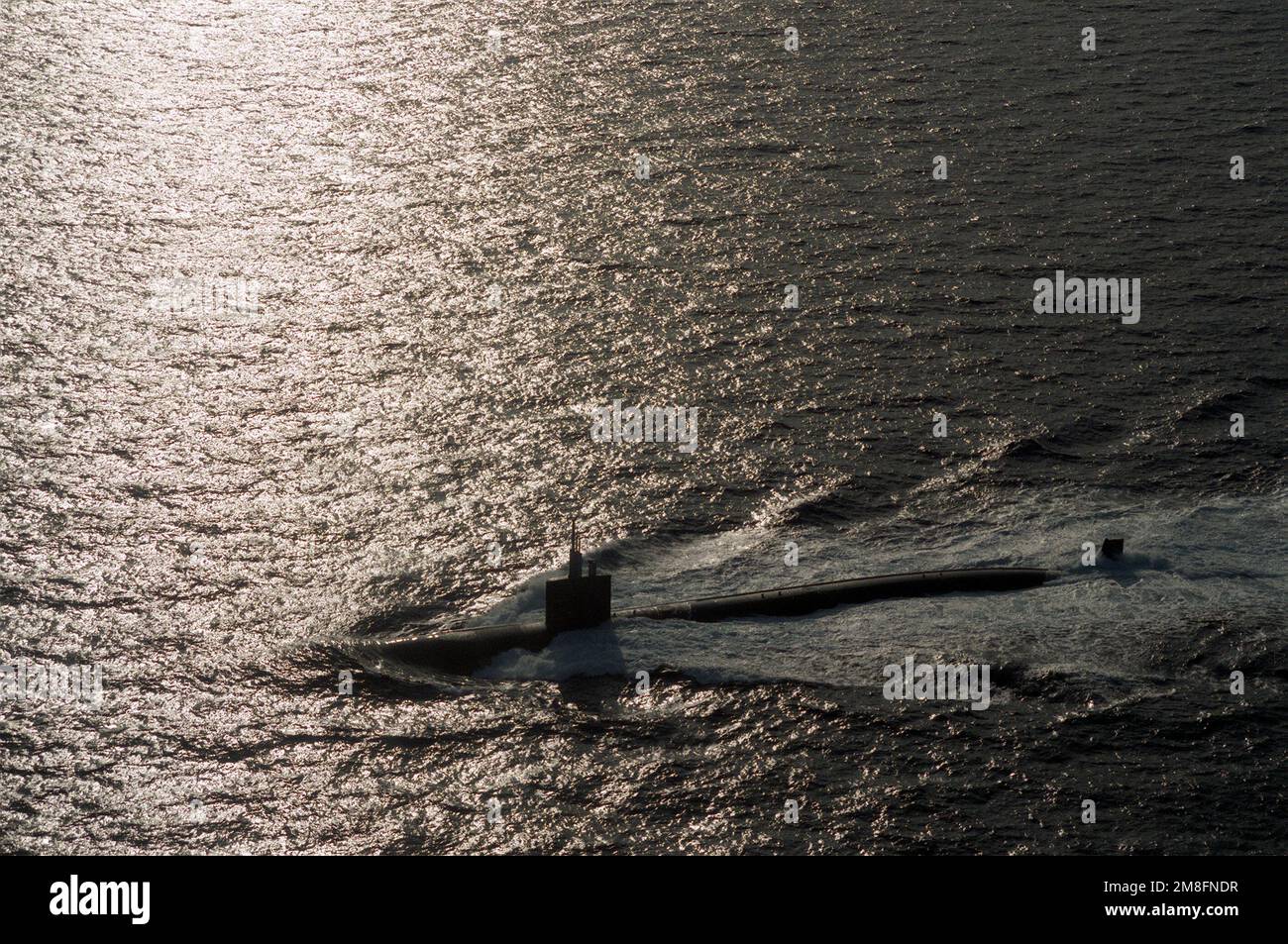 A port beam view of the nuclear-powered attack submarine USS ALEXANDRIA ...