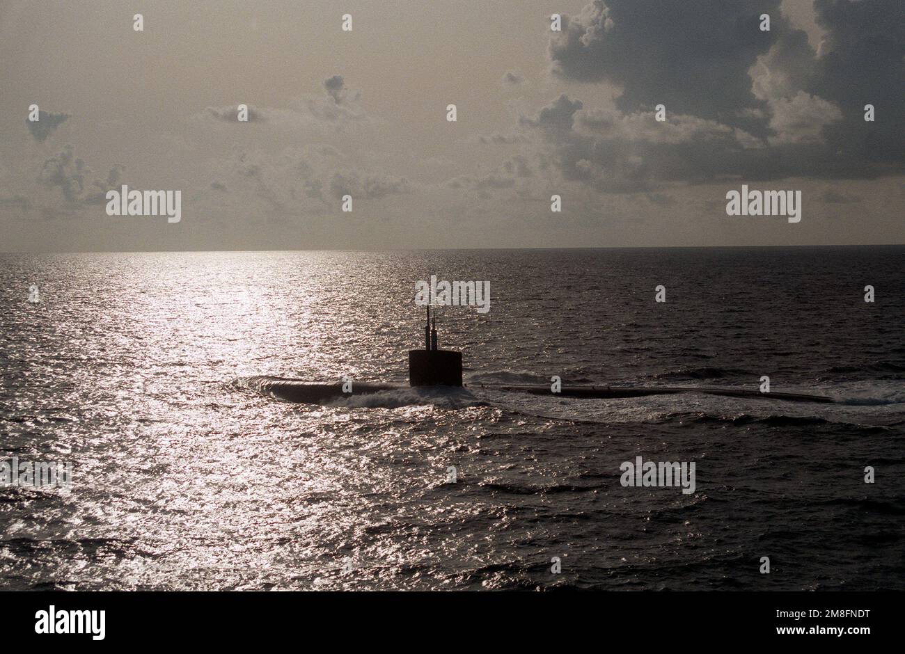 A port beam view of the nuclear-powered attack submarine USS ALEXANDRIA ...
