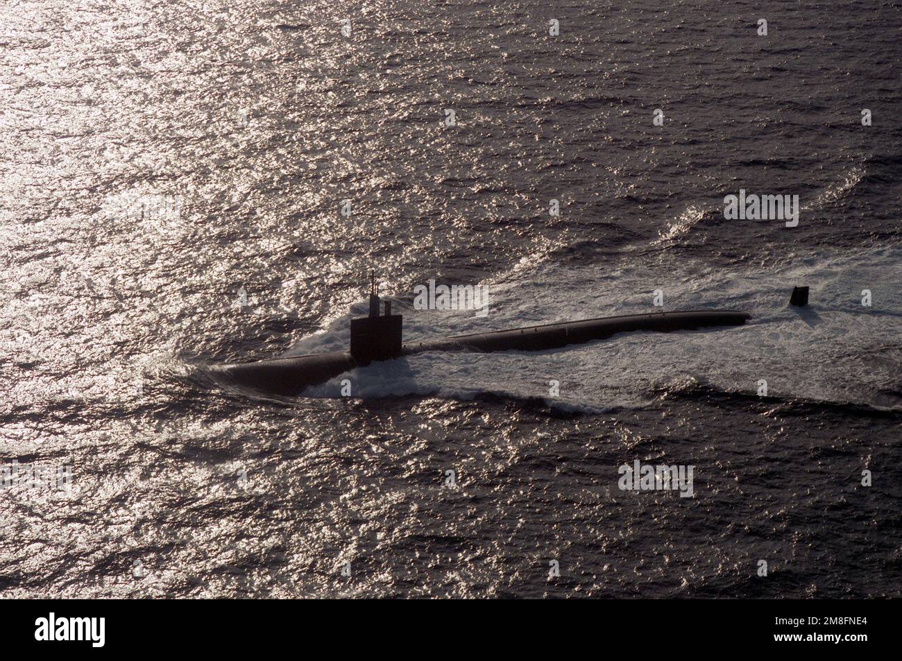 A port beam view of the nuclear-powered attack submarine USS ALEXANDRIA ...