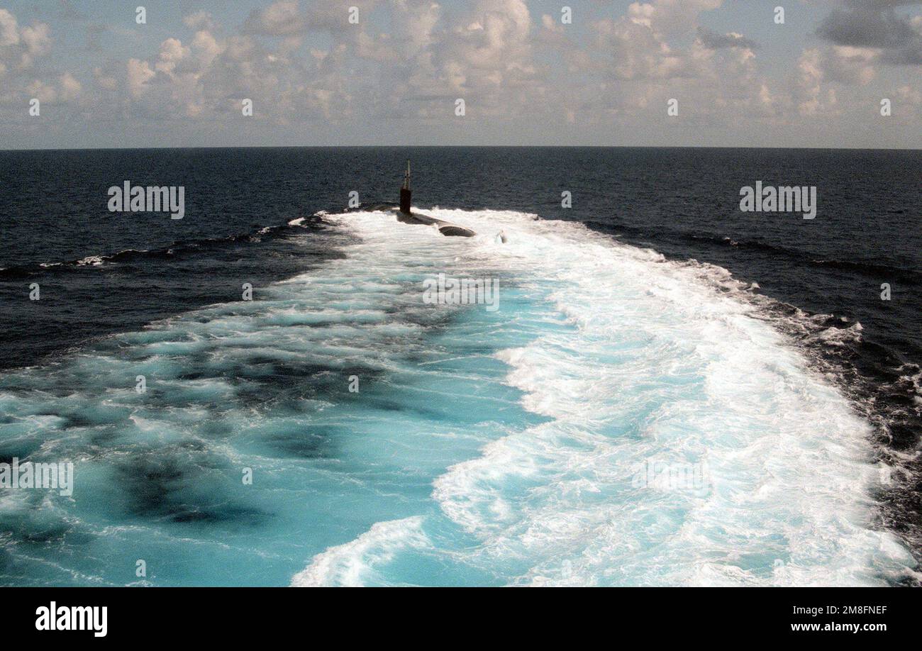 The nuclear-powered attack submarine USS ALEXANDRIA (SSN-757) begins a ...