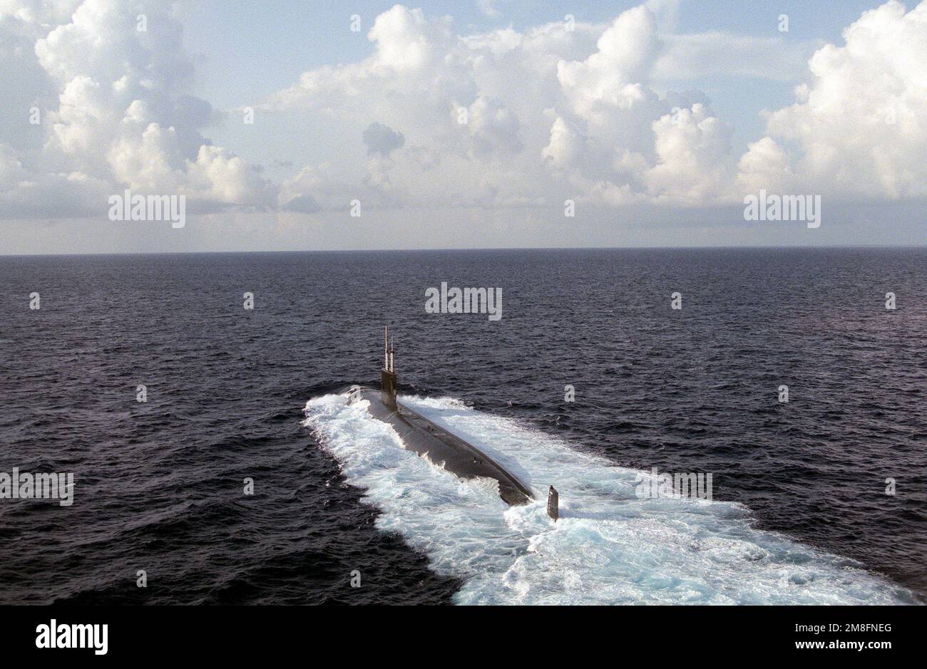 A port quarter view of the nuclear-powered attack submarine USS ...