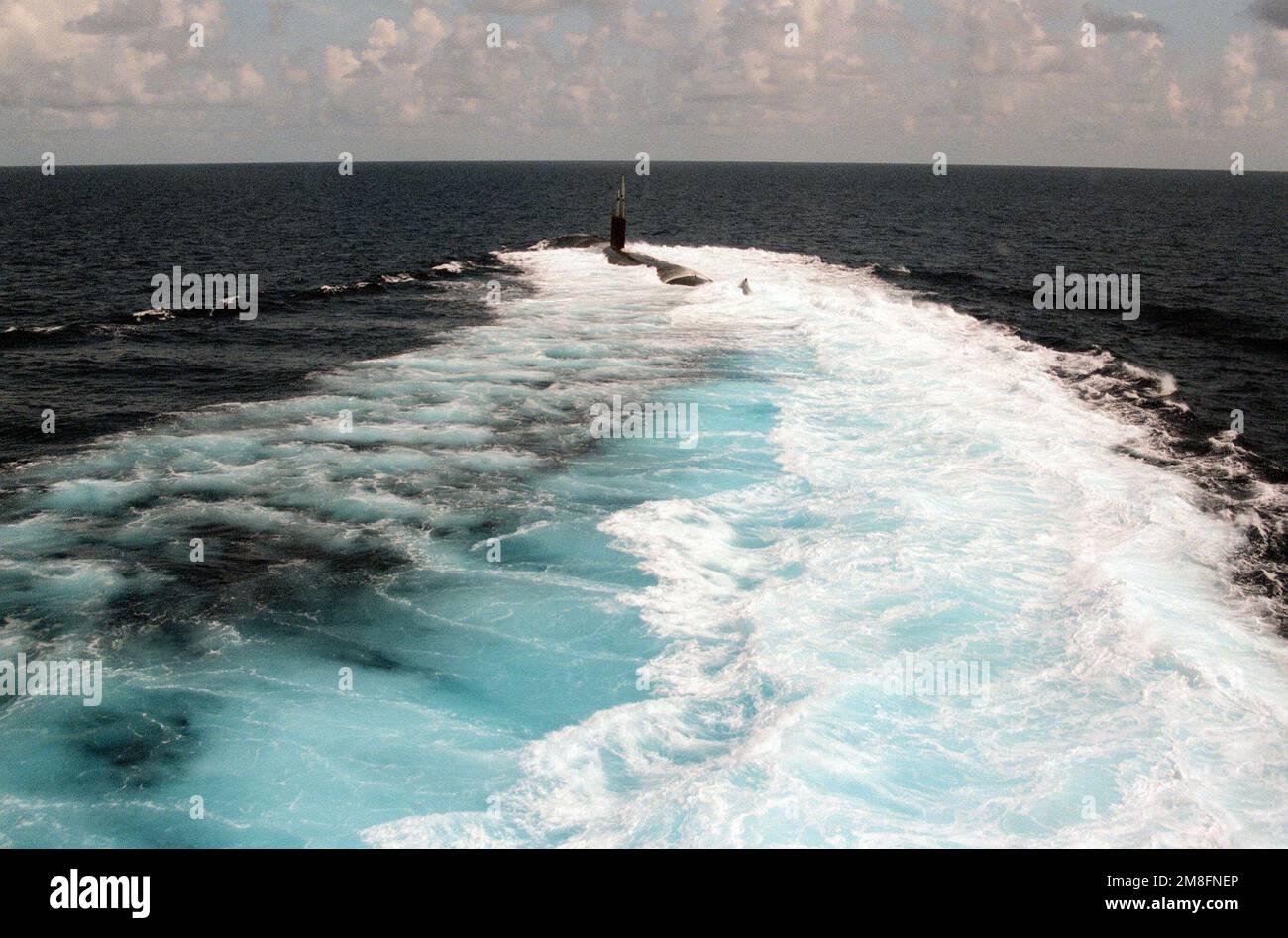 The nuclear-powered attack submarine USS ALEXANDRIA (SSN-757) begins a ...