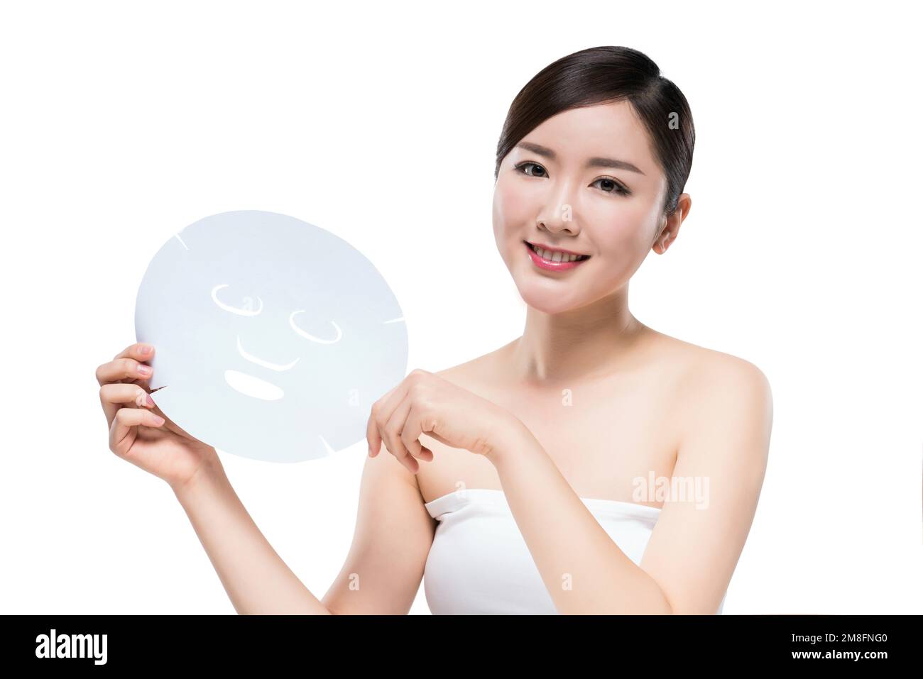 A beautiful young woman holding a mask Stock Photo - Alamy