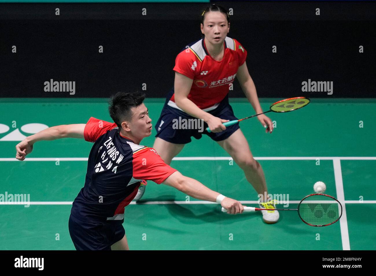 China's Zheng Si Wei, front, and Huang Ya Qiong play a shot against ...