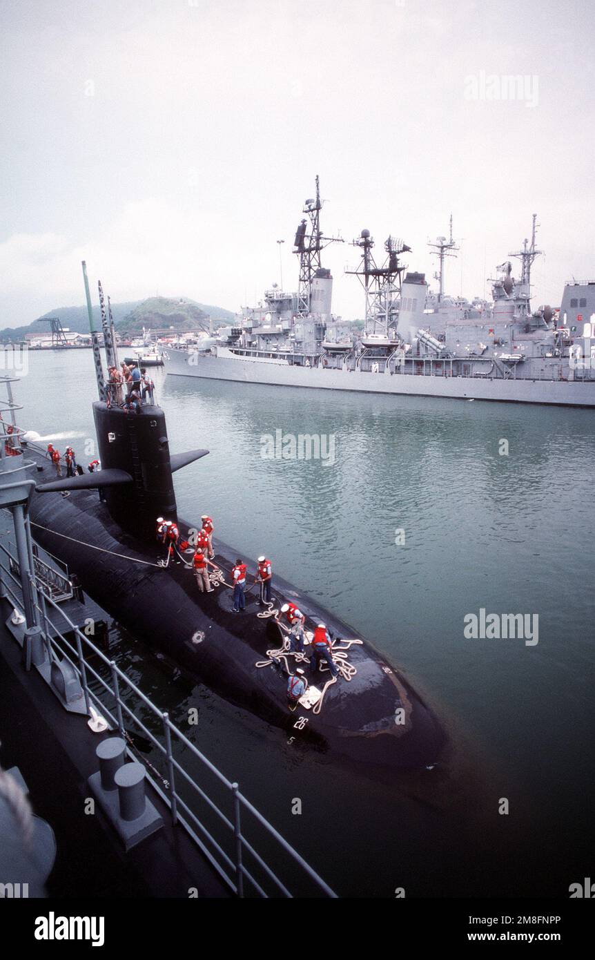 Line handlers tie up the nuclear-powered attack submarine USS SAND ...