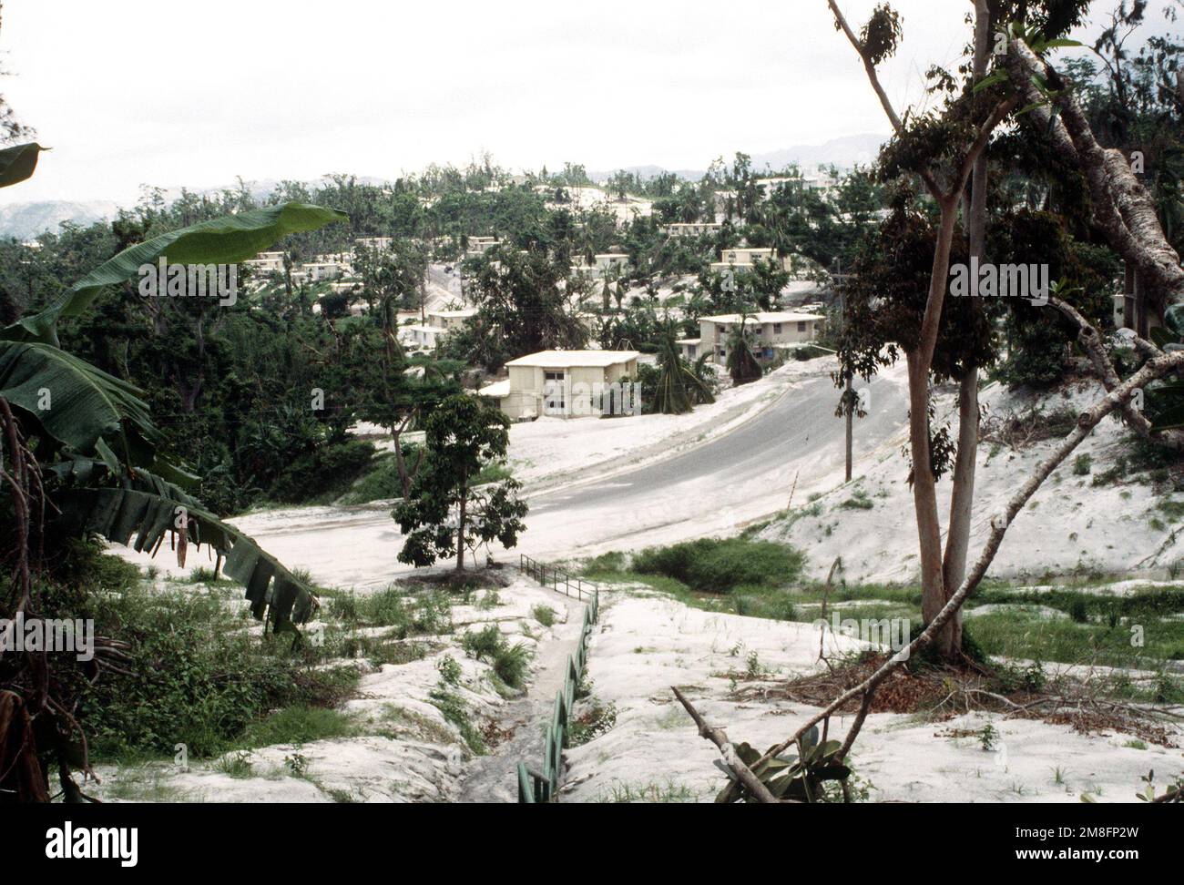 Ash covers the East Kalayaan enlisted housing area in the aftermath of ...