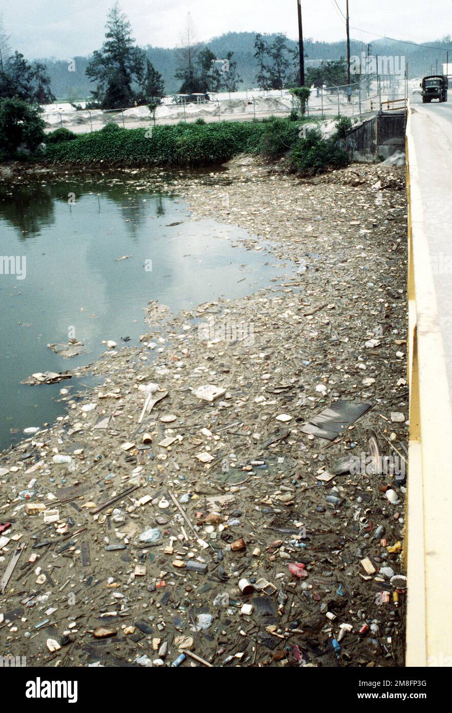 A drainage canal is clogged with debris in the aftermath of Mount ...