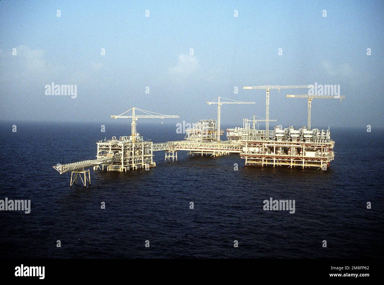A view of an abandoned oil-drilling platform in the gulf during ...