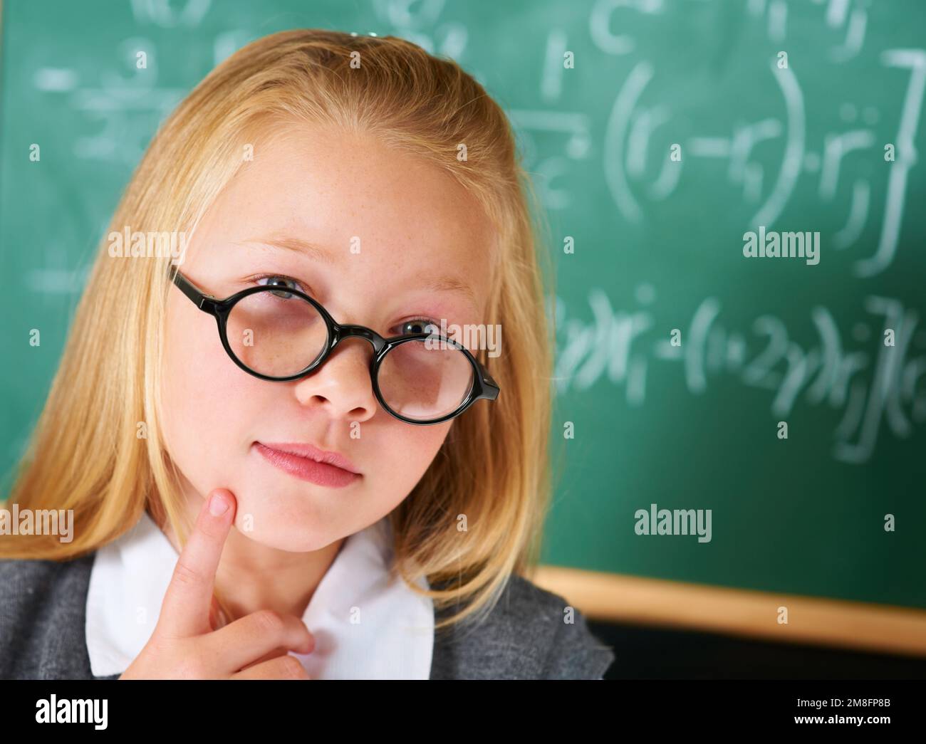 Searching for the solution. Portrait of a cute blonde girl thinking in ...