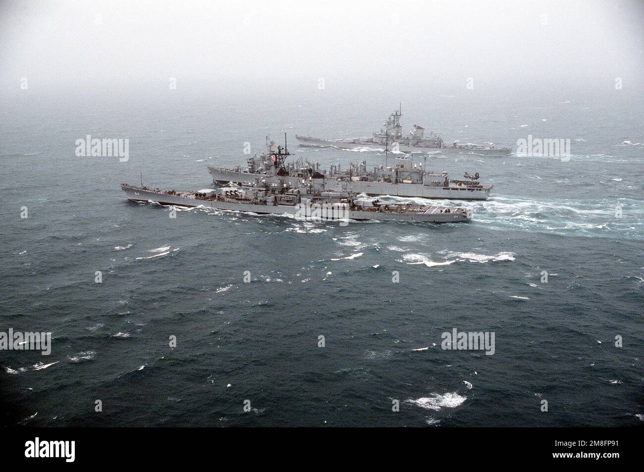 The battleship USS WISCONSIN (BB-64), foreground, conducts an underway ...