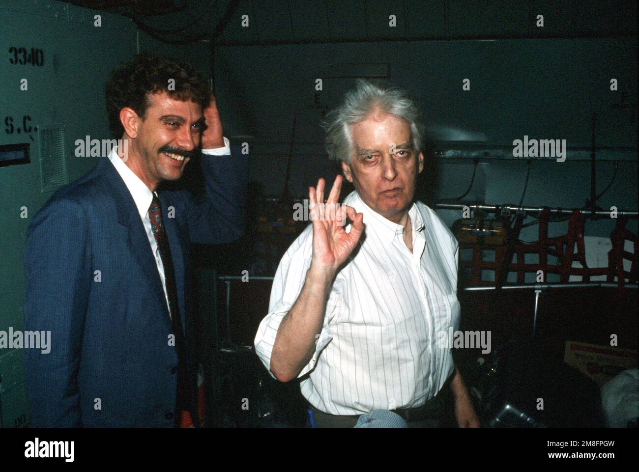 American hostage Edward Austin Tracy gives an OK sign after boarding ...