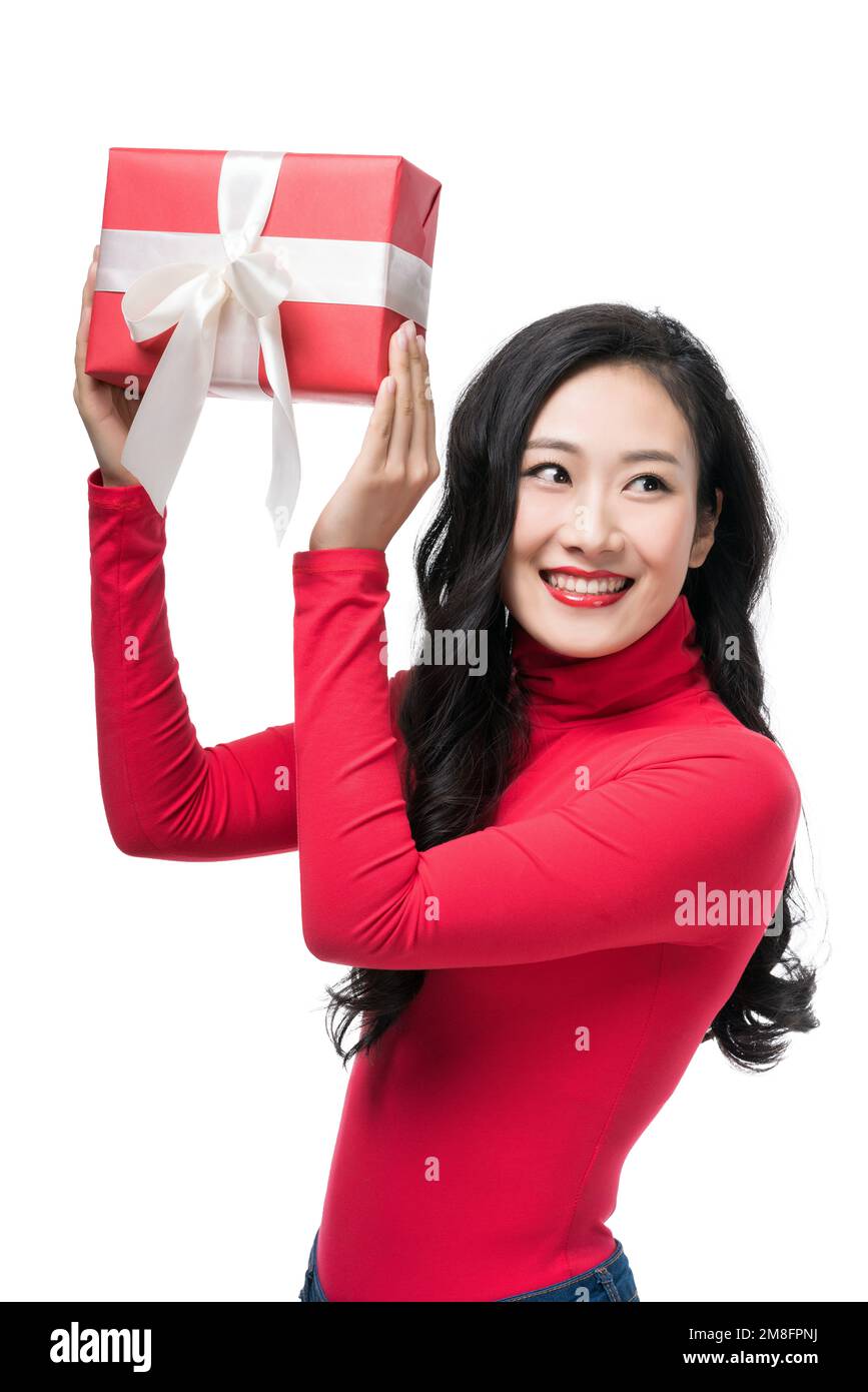 A young woman in red with a gift Stock Photo - Alamy