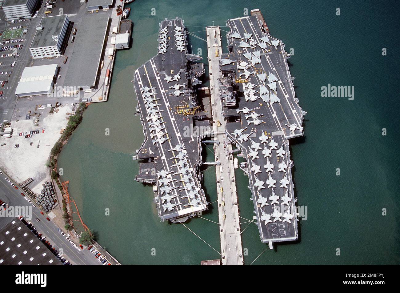An aerial view of various aircraft lining the flight decks of the ...