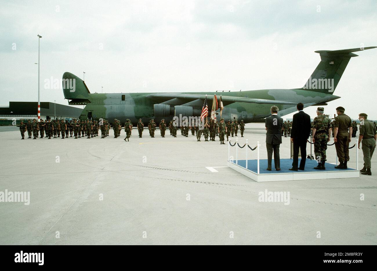 U.S. and Dutch officials stand on a platform during a ceremony marking ...