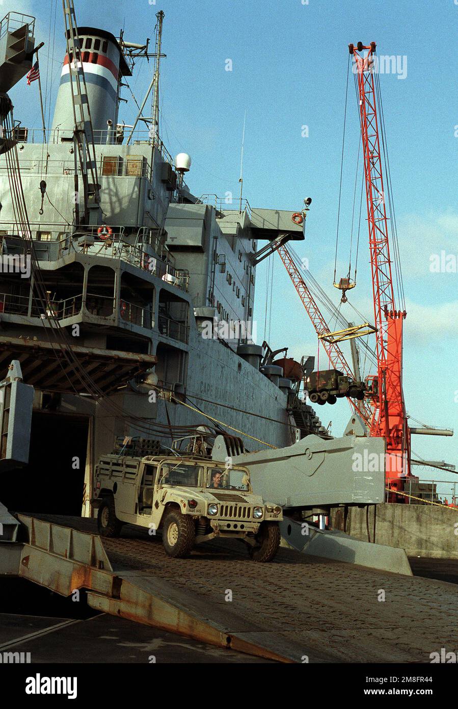 An M998 High-Mobility Multipurpose Wheeled Vehicle (HMMWV) exits from ...