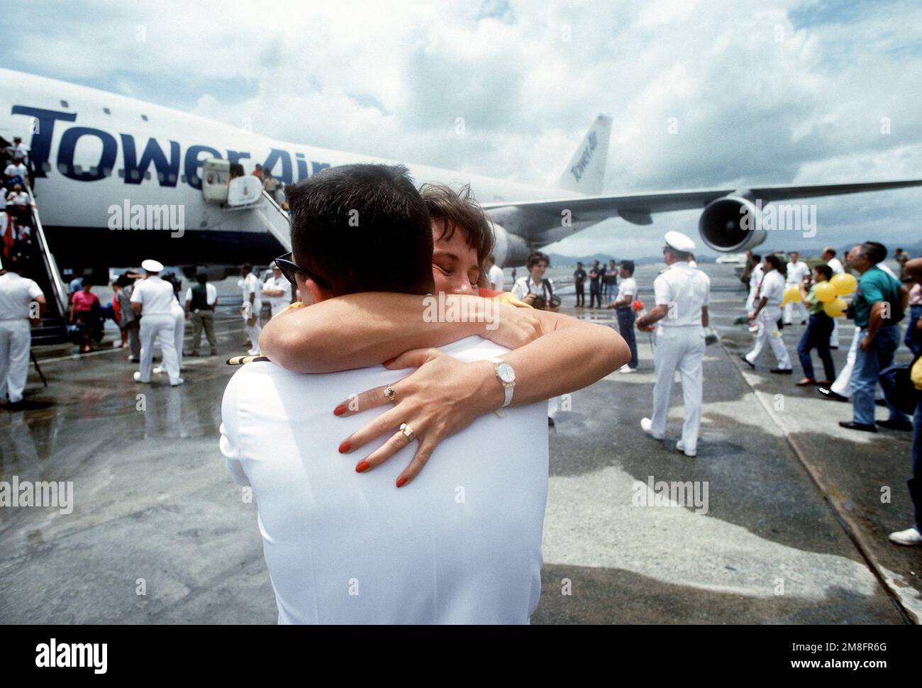 A Navy couple is reunited as military dependents return to the area ...