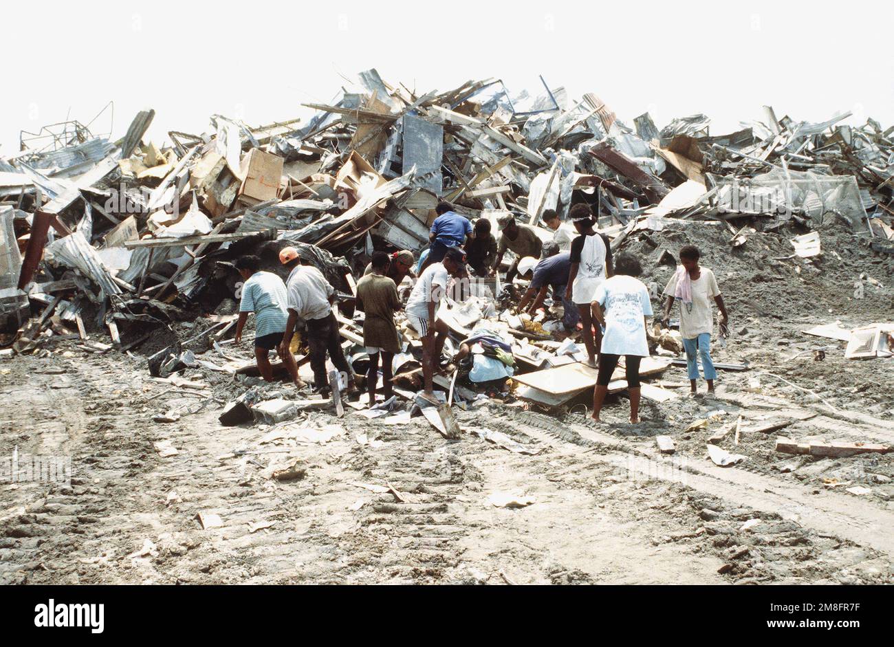 Local residents sort through debris in the aftermath of Mount Pinatubo ...