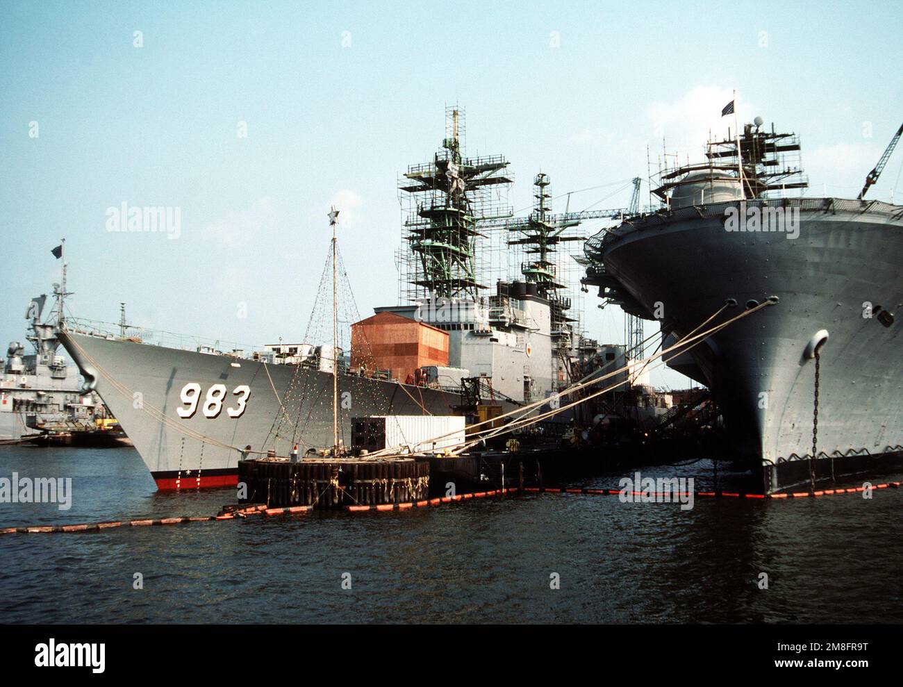 The destroyer USS JOHN RODGERS (DD 982), left, and the amphibious ...
