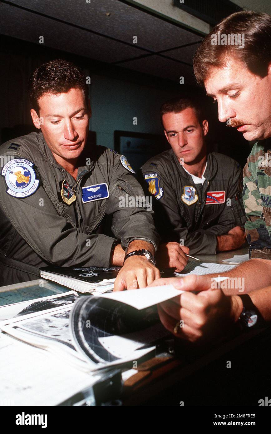 STAFF SGT. Gordon Chapman, left, Det. 2, 20th Weather Squadron, gives a ...