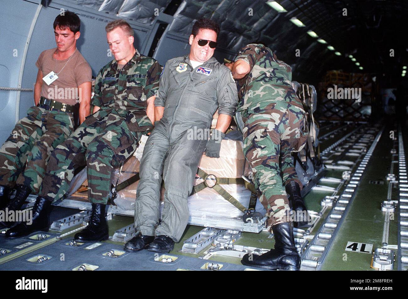 SENIOR AIRMAN Abel Saenz, wearing the flight suit, a boom operator with ...