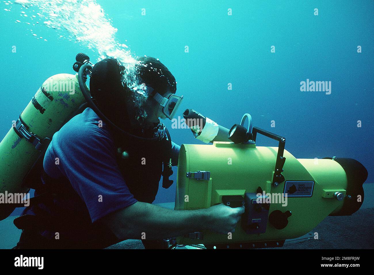 Photographer's Mate (Diver) 2nd Class Greg Slater, uses a waterproofed ...