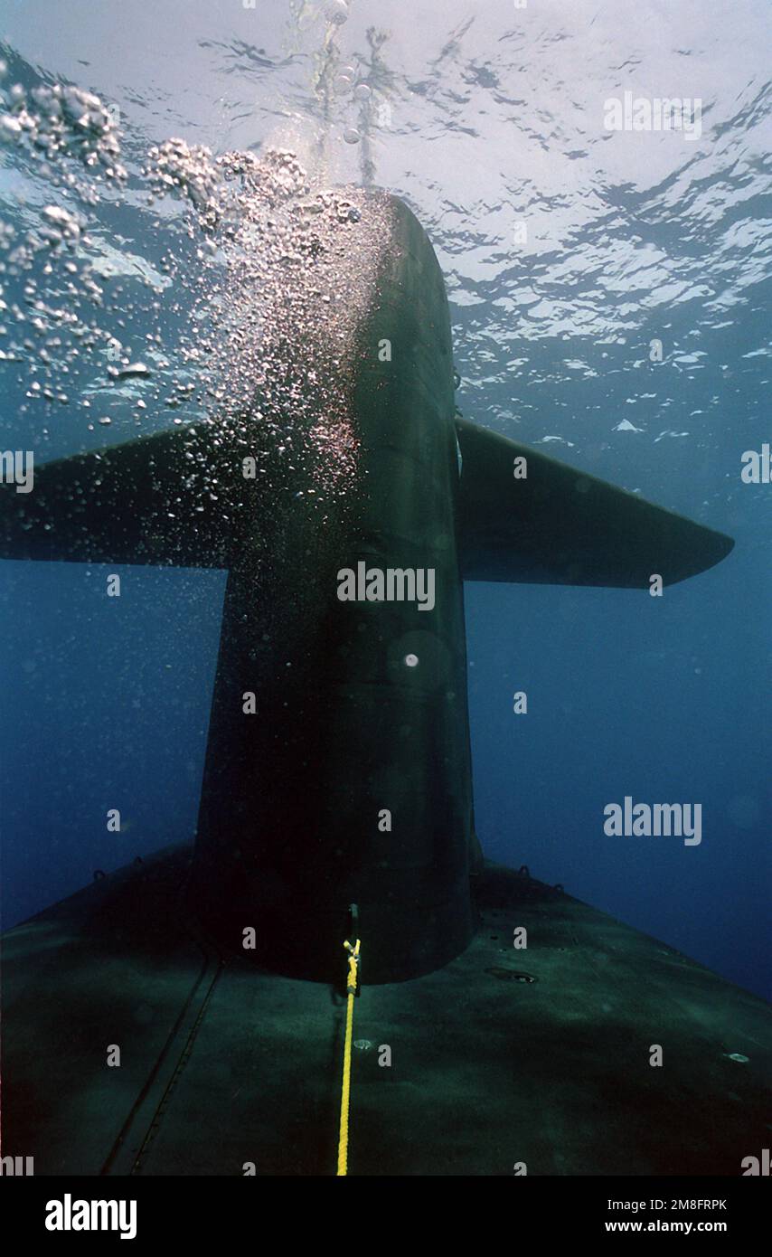 A line is rigged to the sail of the submerged nuclear-powered strategic ...