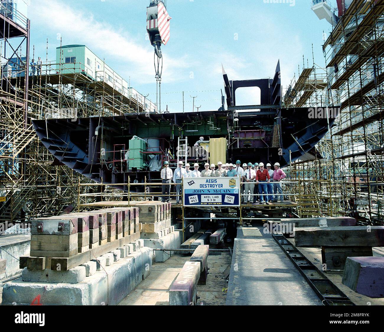 Representatives of the U.S. Navy and Bath Iron Works Corp. gather on ...