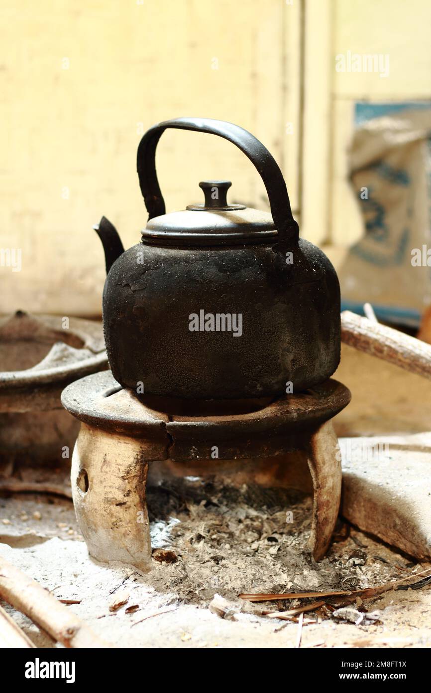 close up black traditional kettle full of soot on the stove Stock Photo ...
