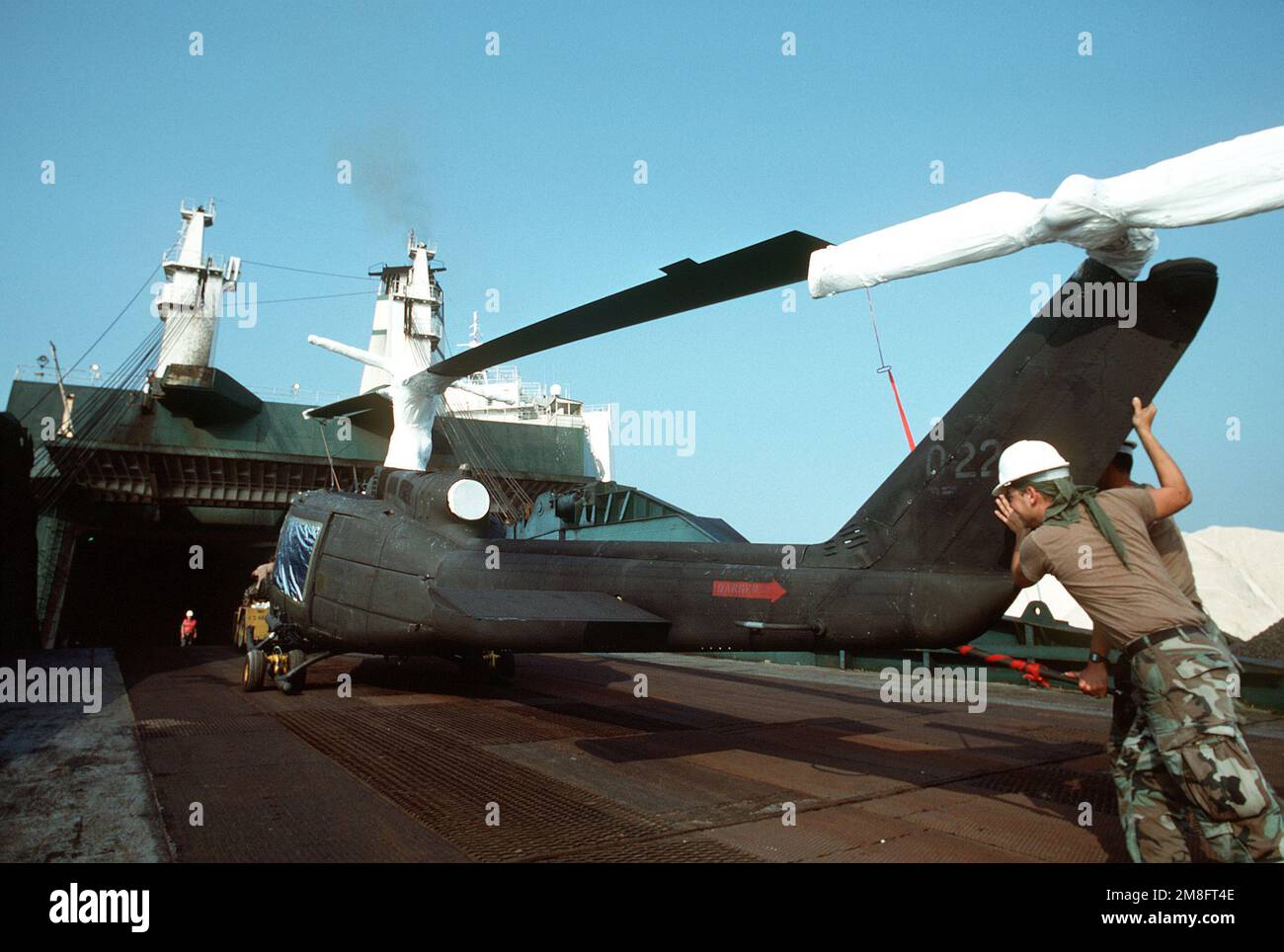 Two soldiers from the 1181st Transportation Terminal Unit hold up the ...
