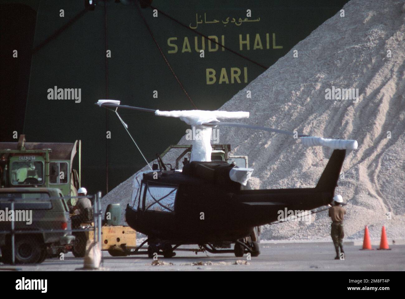 A soldier from the 1181st Transportation Terminal Unit holds the tail ...