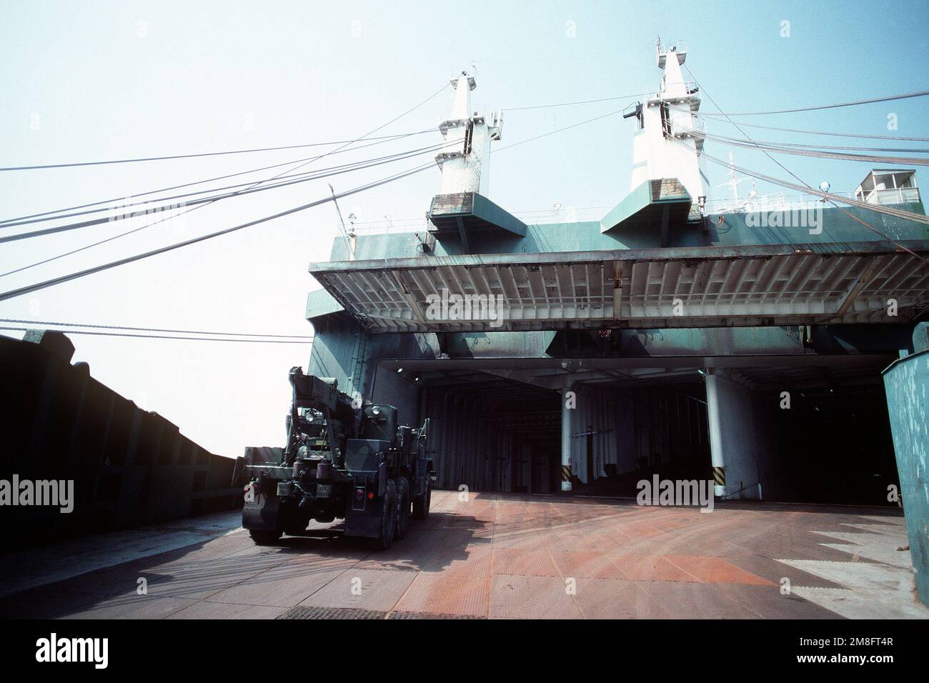 An M-816 5-ton wrecker is driven onto the Saudi Arabian roll-on/roll ...