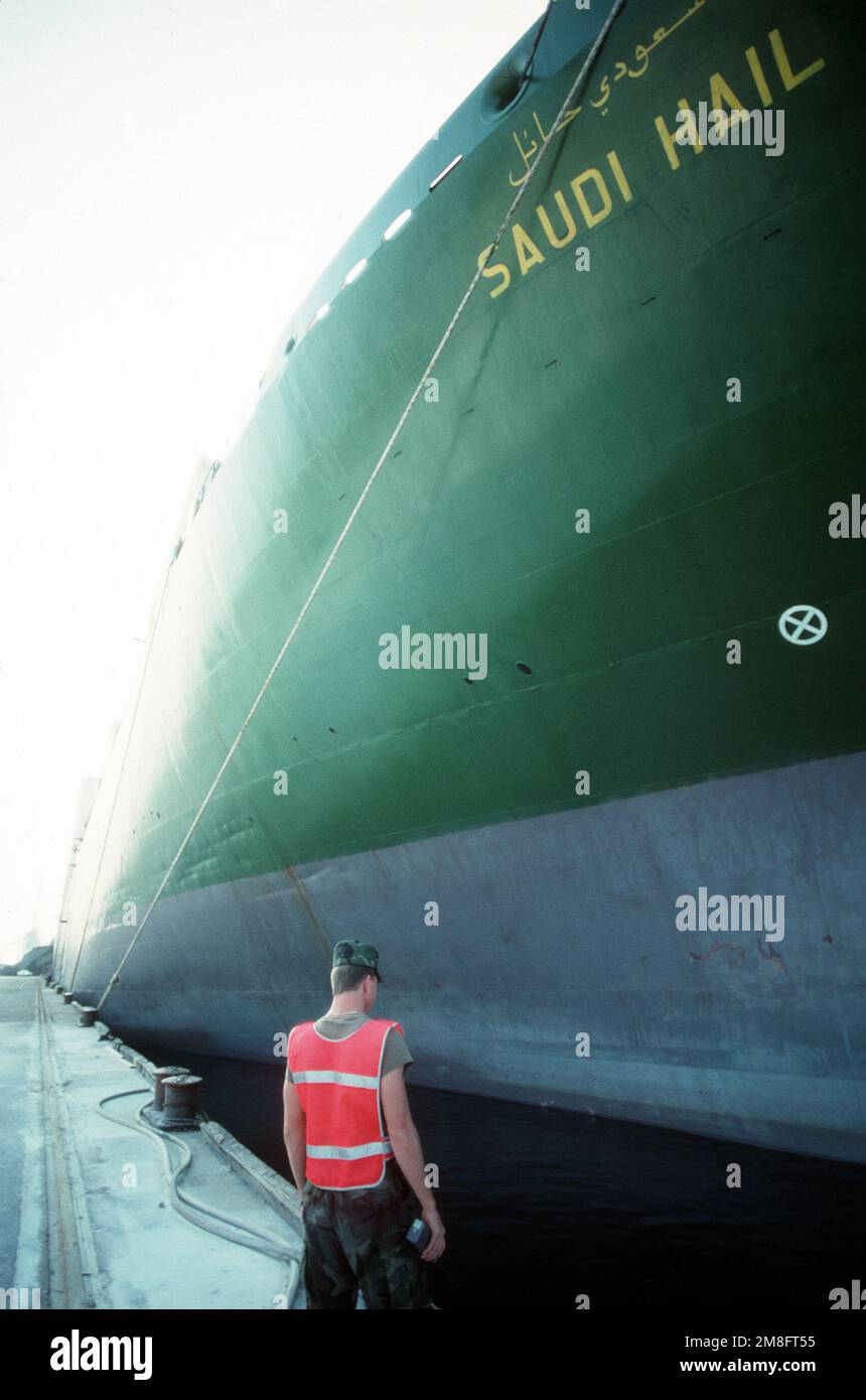 A soldier of the 1181st Transportation Terminal Unit stands near the ...