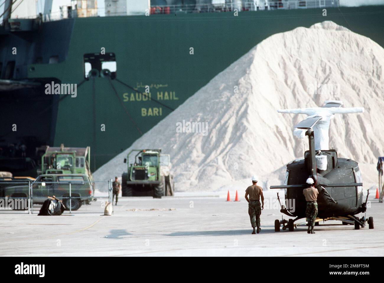 A soldier from the 1181st Transportation Terminal Unit holds the tail ...