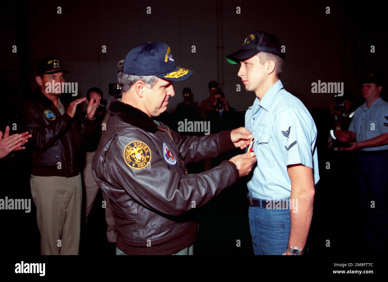 Undersecretary of the Navy J. Daniel Howard pins the Navy and Marine ...