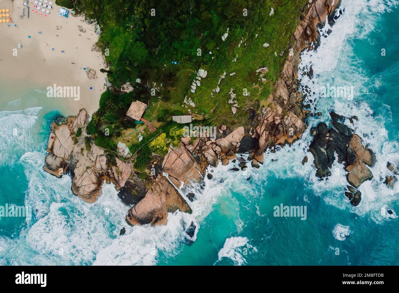 Scenic coastline with beach, rocks and blue ocean with waves in Brazil ...