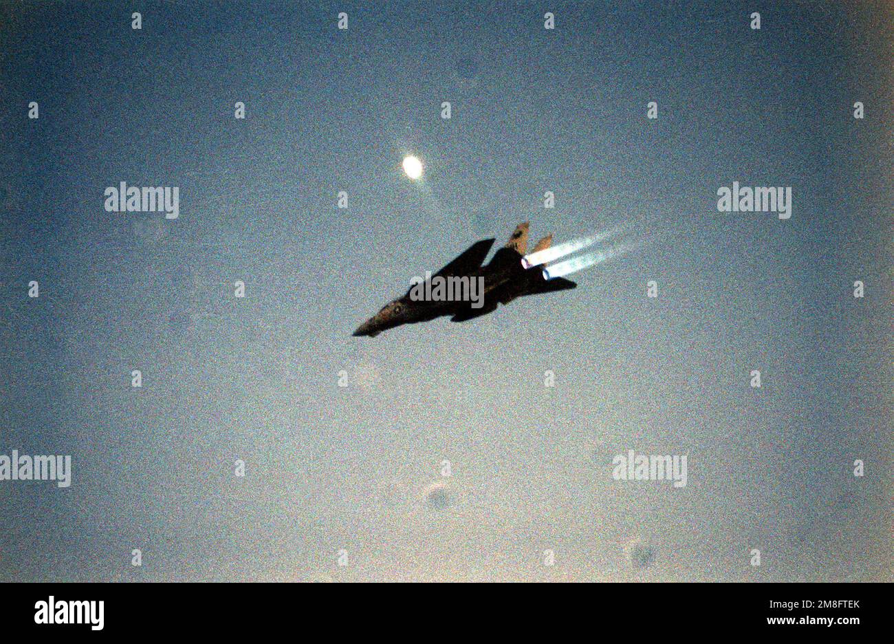 An air-to-air underside view of a Fighter Squadron 114 (VF-114) F-14A ...