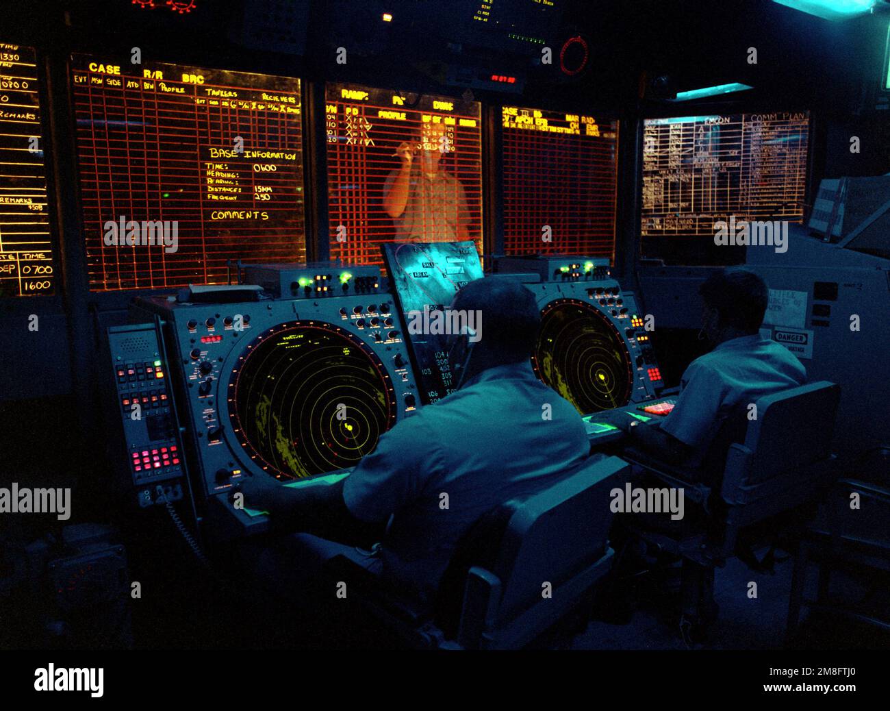 Crewman man air operations radar console in the combat direction cetner ...