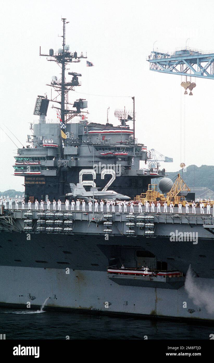 The crew of the aircraft carrier USS INDEPENDENCE (CV-62) mans the ...