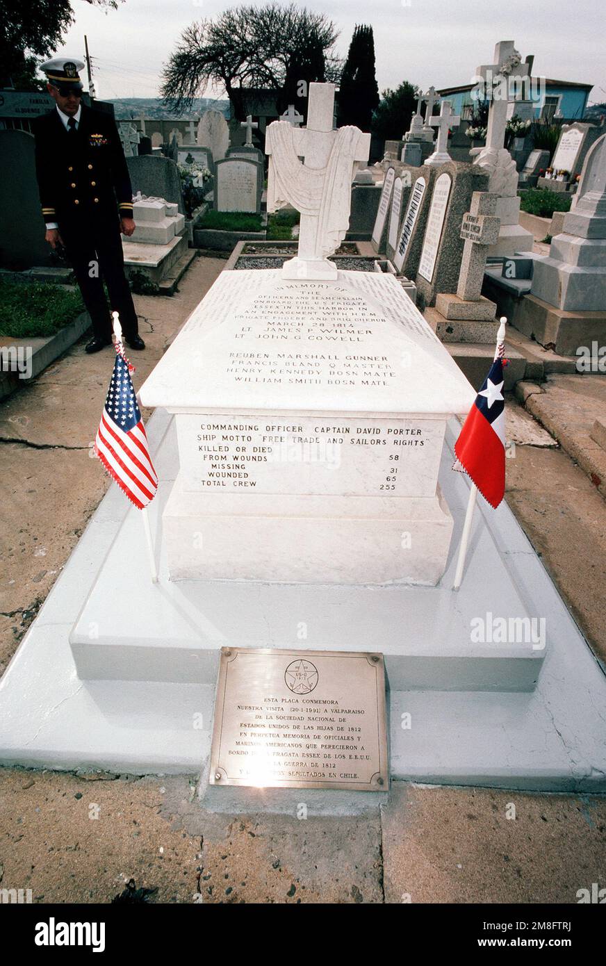 A US Naval officer visits a memorial to crew members of the American ...