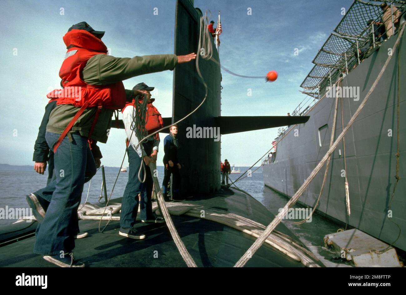 A crew member aboard the nuclear-powered attack submarine USS SAND ...