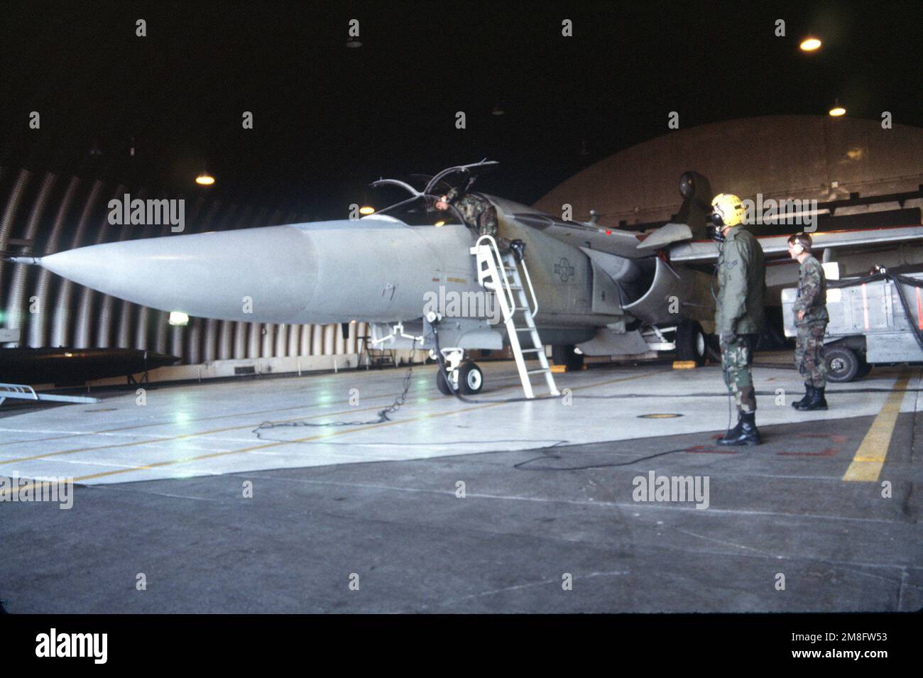 The crew chief of a 42nd Electronic Combat Squadron EF-111A Raven ...