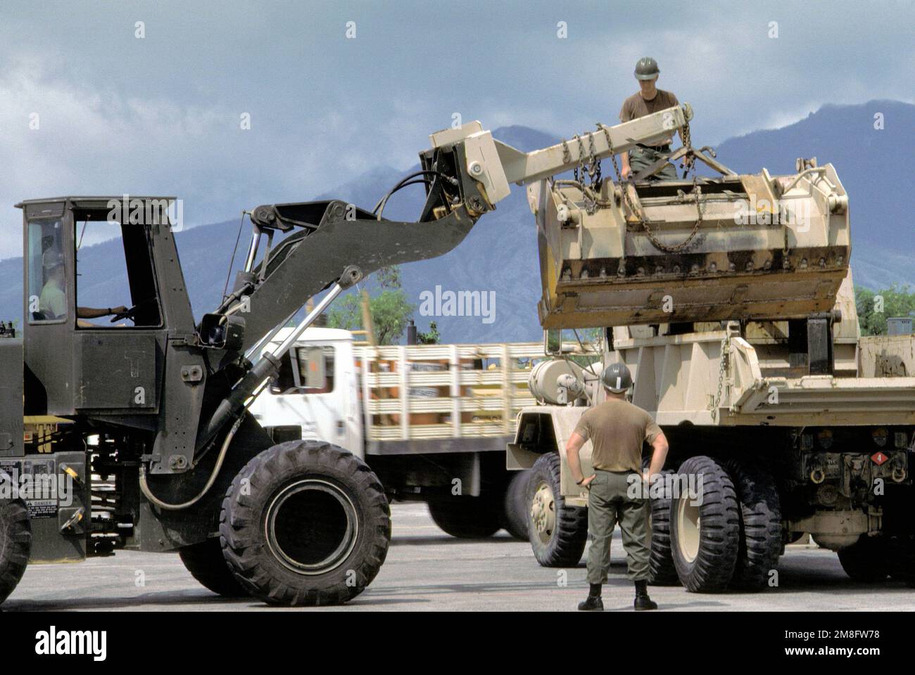 Seabees from Naval Mobile Construction Battalion 4 (NMCB-4) use a ...