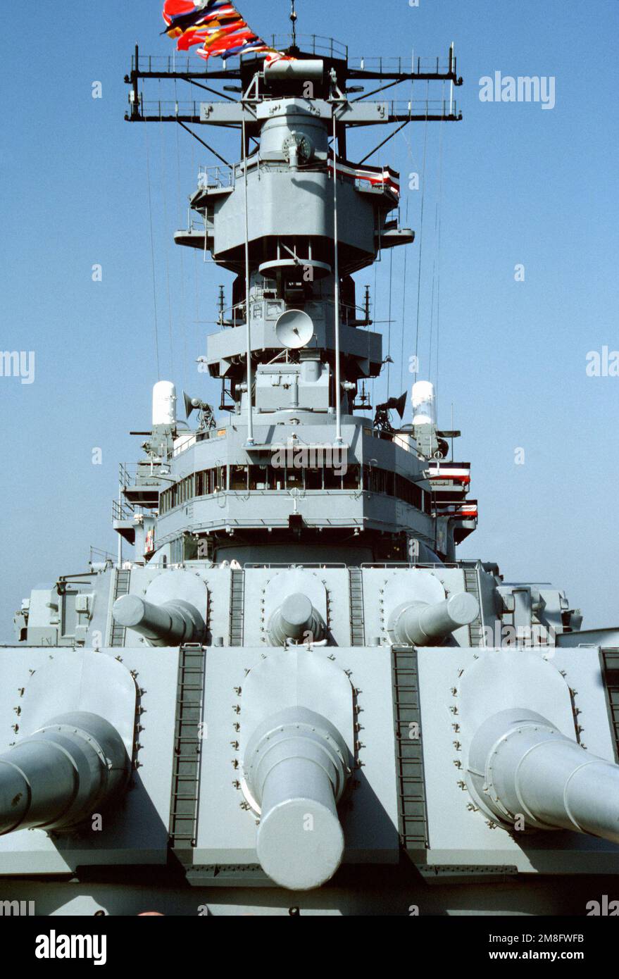 A view of two of the Mark 7 16-inch/50-caliber gun turrets and the ...