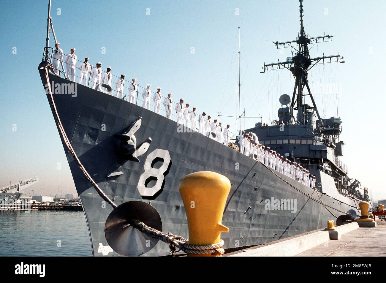 Crew members man the rails of the guided missile destroyer USS LYNDE ...