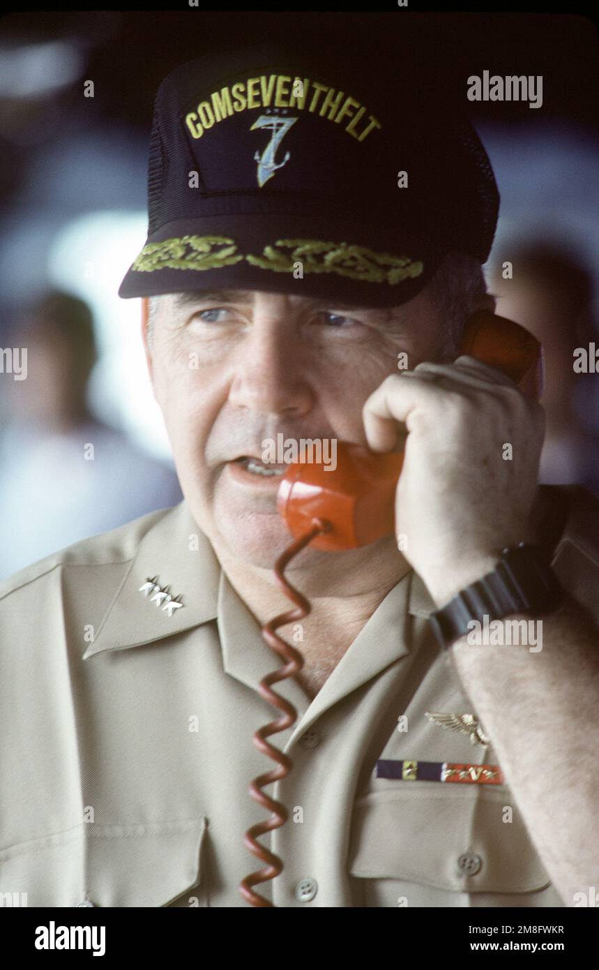 VADM Stanley R. Arthur, commander, Seventh Fleet, communicates with the ...
