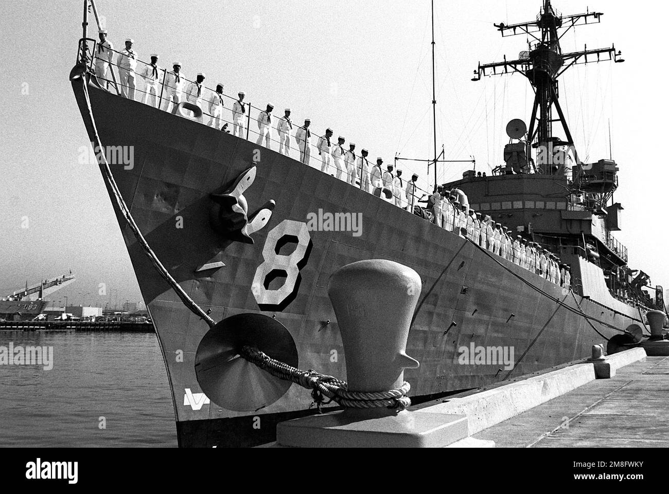 Crew members man the rails of the guided missile destroyer USS LYNDE ...